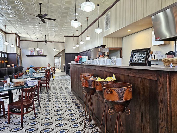 Step into this time capsule where pendant lights dangle from tin ceilings, illuminating a century of sweet memories and marble countertops.