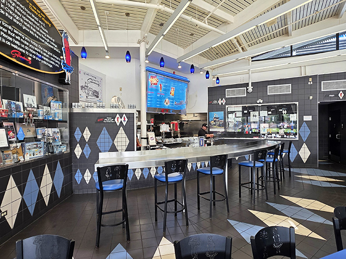 Diamond-patterned tiles and sleek countertops transport diners to a mid-century wonderland where hot dogs reign supreme.