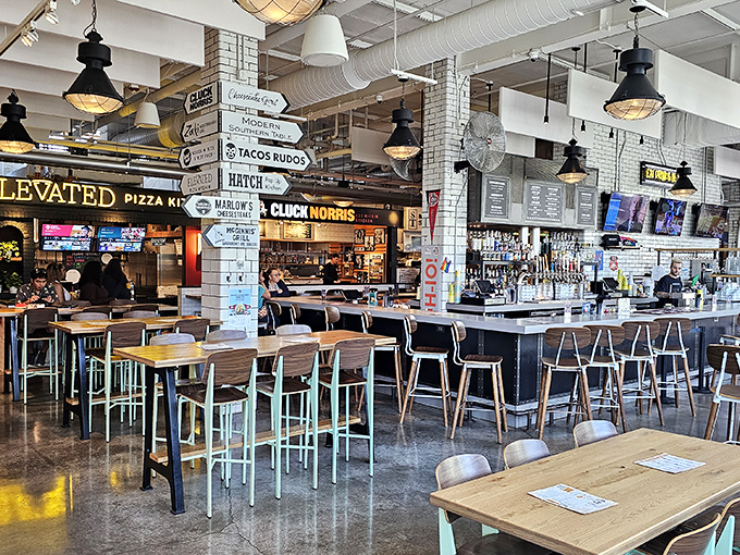 The bustling interior of Budd Dairy Food Hall combines industrial chic with modern comfort, creating the perfect backdrop for a gastronomic adventure.