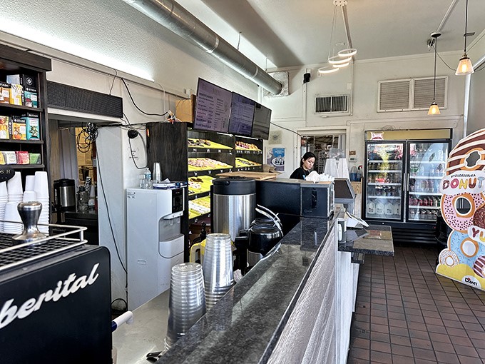 Inside, the no-frills interior focuses on what matters most &ndash; getting freshly made donuts from skilled hands to eager customers without unnecessary fuss.