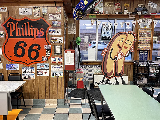 Wood-paneled walls adorned with Route 66 memorabilia create a museum-like atmosphere where every corner tells a story of American road culture.