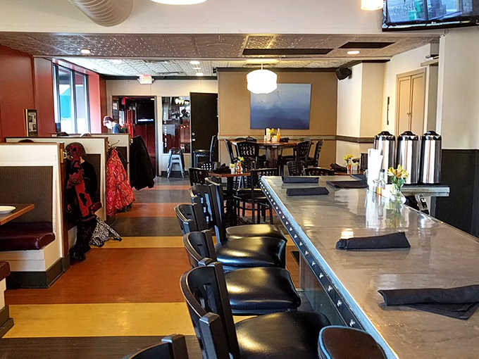 Wood-paneled walls and simple furnishings create the perfect backdrop for food that steals the spotlight in this cozy, unpretentious dining room.