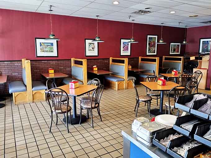Red plastic seats and wood-paneled walls create the perfect no-nonsense backdrop for the serious business of barbecue consumption.