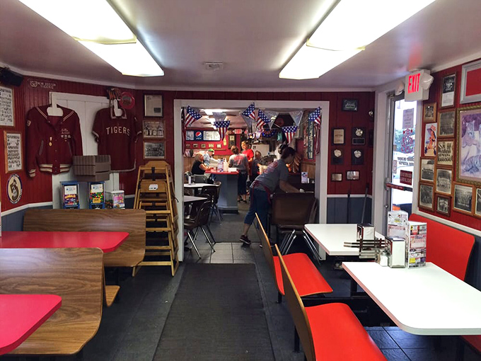 Step inside and you're transported to a simpler time &ndash; red walls adorned with local sports memorabilia and decades of community history.