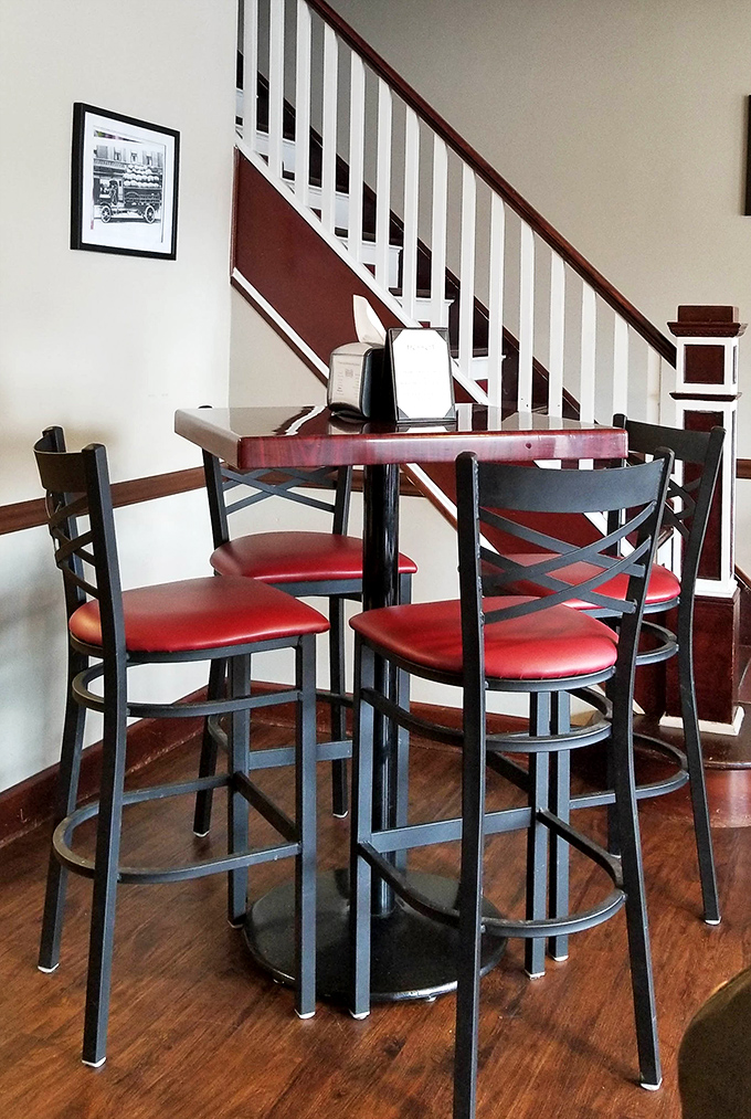 High-top tables with those signature red vinyl seats &ndash; the perfect perch for serious wing business.