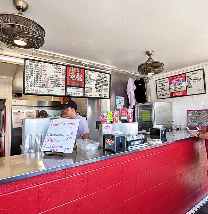 Interior: Red vinyl booths and polka dot curtains create a time capsule of Americana where conversations flow as freely as the coffee refills.