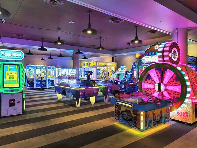 Neon lights dance across the arcade floor, where classic games and new favorites create a symphony of beeps, boops, and nostalgic thrills.