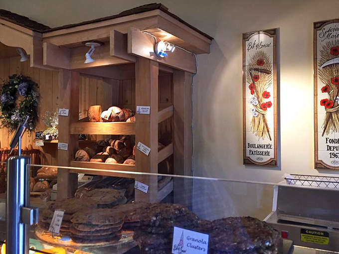 Wooden shelves cradle artisan loaves like precious cargo, while decorative panels celebrate the bakery's heritage &ndash; a shrine to the art of breadmaking.