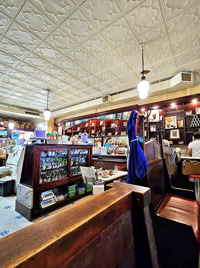 Ornate tin ceilings, vintage pendant lights, and polished wood create a time capsule where calories don't count and memories are made.