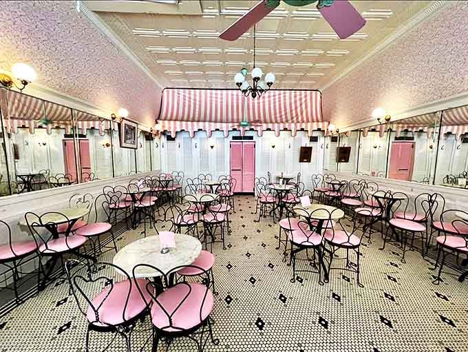 Step into a time capsule of elegance &ndash; pink chairs, marble tables, and striped awnings create an ice cream parlor straight from a nostalgic dream.