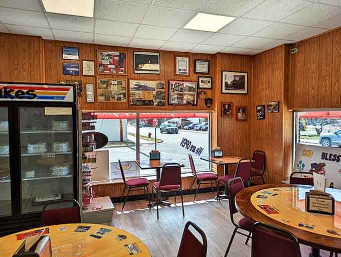 Wood-paneled walls adorned with local memorabilia create that "everybody knows your name" vibe that chain cafés spend millions trying to fake.