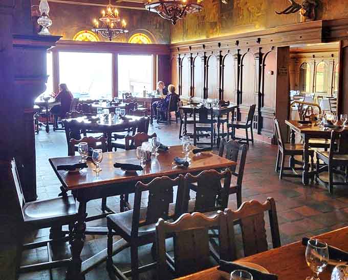 Dark wood paneling and stained glass windows create an atmosphere where time slows down and conversations deepen over plates of perfectly prepared steaks.