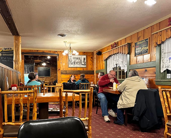 Warm wood paneling creates a cozy dining atmosphere where conversations flow as freely as the coffee refills.