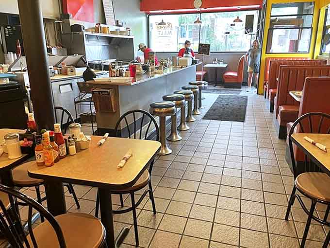 Classic diner charm meets Midwestern hospitality inside, where counter seats offer front-row views to breakfast magic in the making.
