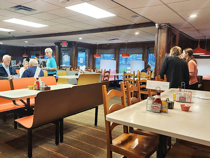 Inside Hyde's, orange booths and wooden chairs create that perfect diner atmosphere where strangers become friends over plates of comfort food.