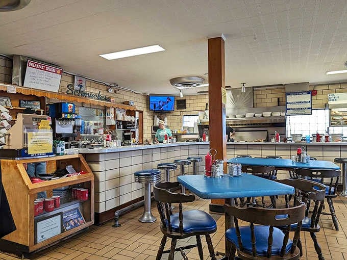 Classic diner charm with blue Formica tables and counter seating &ndash; where regulars have claimed their spots for decades.