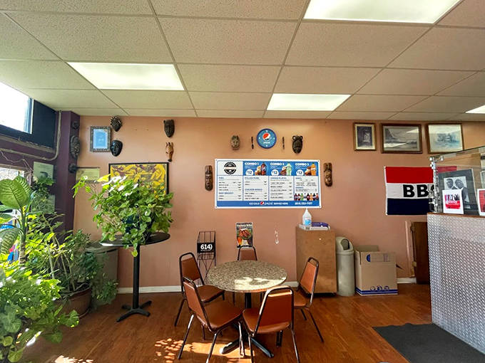 Simple, homey interior with peach walls and African masks creates the perfect no-frills backdrop for serious barbecue enjoyment.