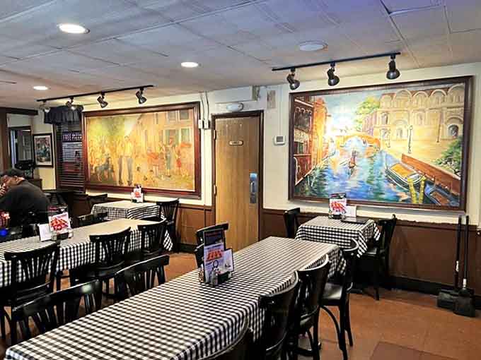 Step inside to a world where checkered tablecloths and Italian murals transport you to the heart of Detroit's pizza paradise.