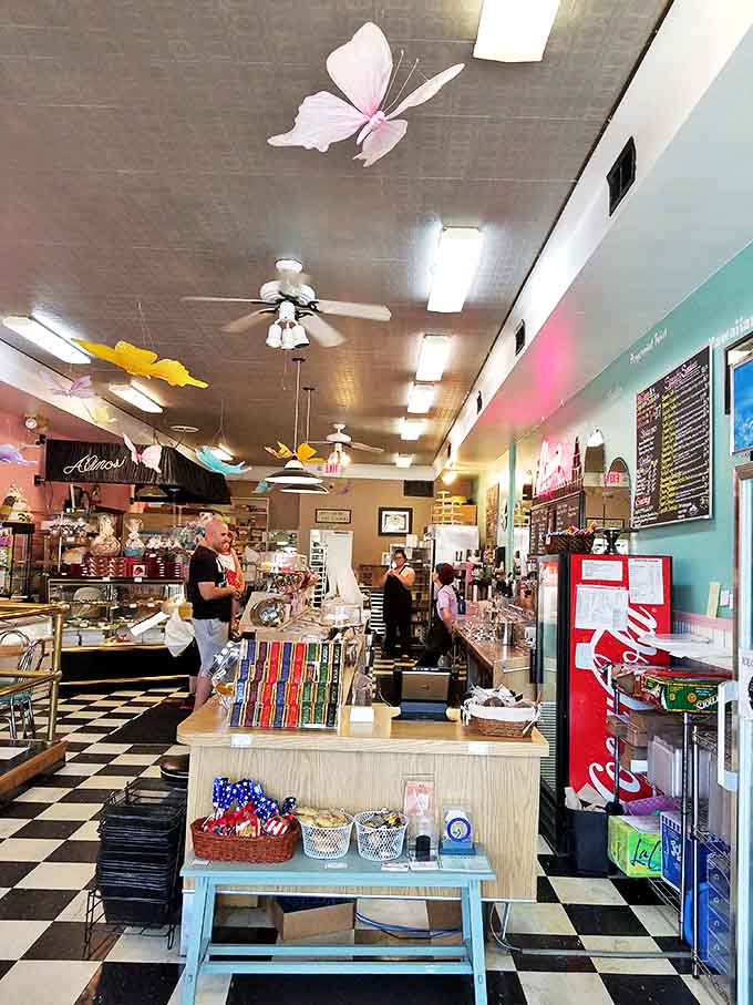 Step inside and time rewinds &ndash; colorful butterflies dance from the ceiling while the classic black and white checkered floor sets the stage for dessert theater.
