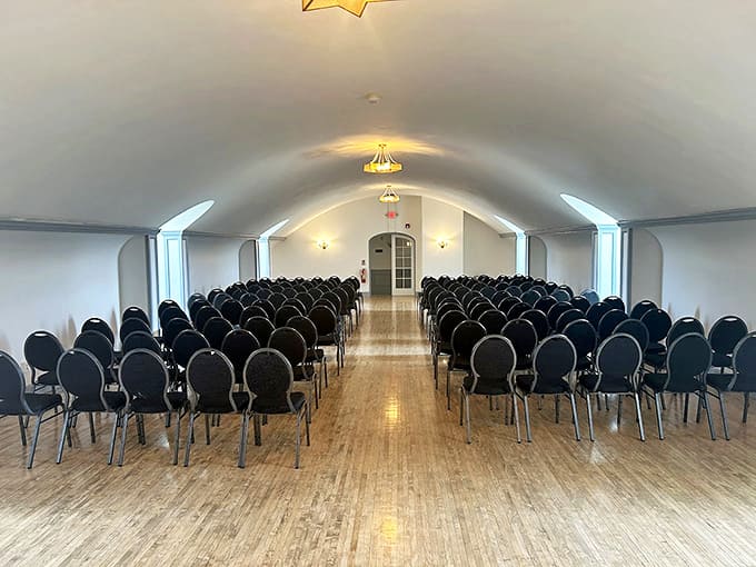 Interior: Rows of elegant chairs stand at attention in this arched gathering space, ready for everything from poetry readings to paranormal investigations.