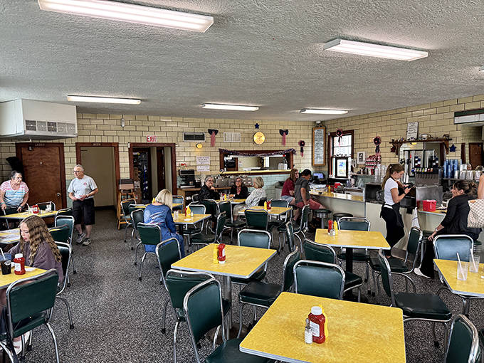 Yellow Formica tables and green chairs create a time capsule of Americana where conversations flow as freely as the ice cream.