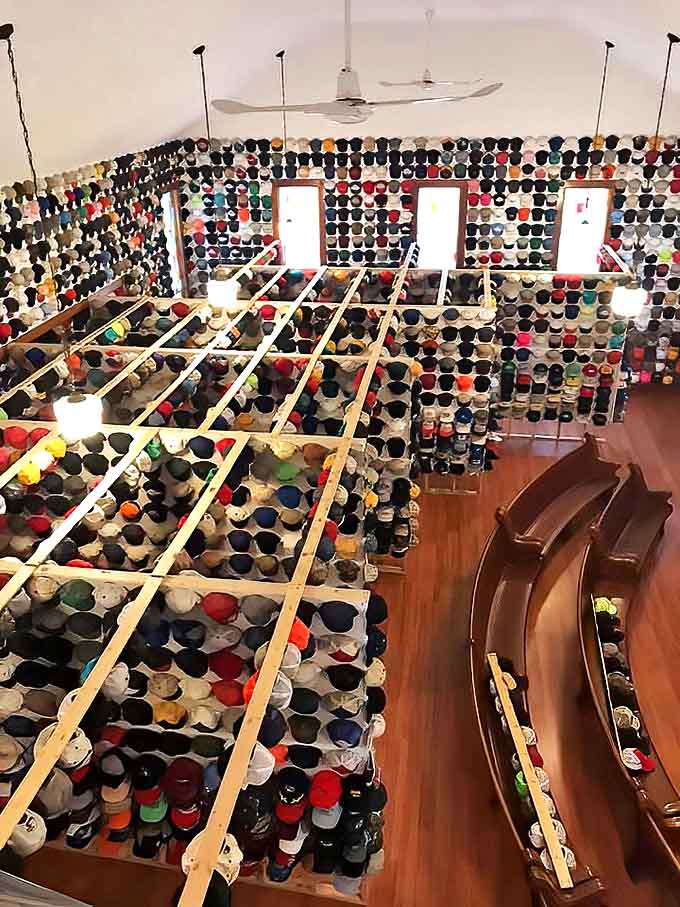 Looking down from the balcony reveals an ocean of caps—thousands of stories told through logos, colors, and well-worn brims.