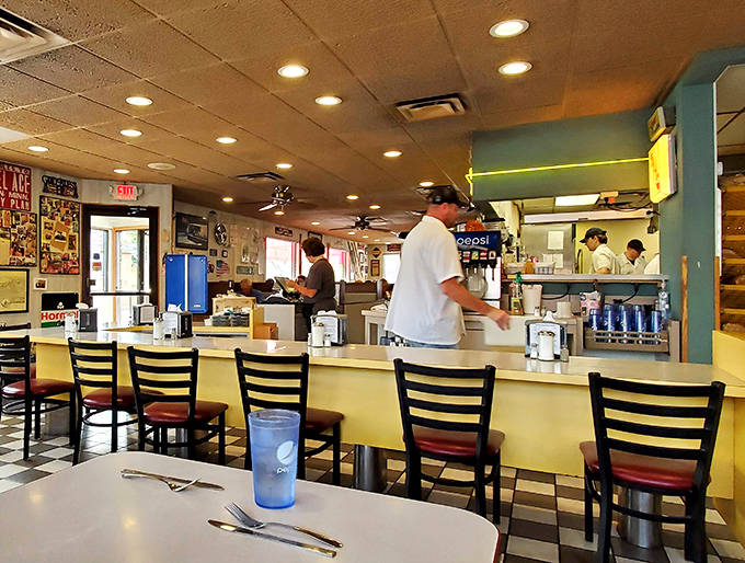 The counter seating offers front-row tickets to the short-order cooking show, where breakfast magic happens at lightning speed.