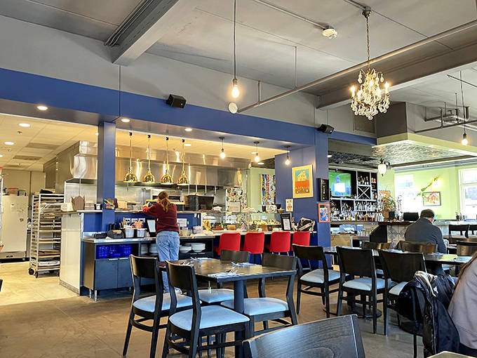 The dining room balances sophistication with comfort &ndash; those crystal chandeliers hanging from industrial ceilings create the perfect NOLA-inspired atmosphere.