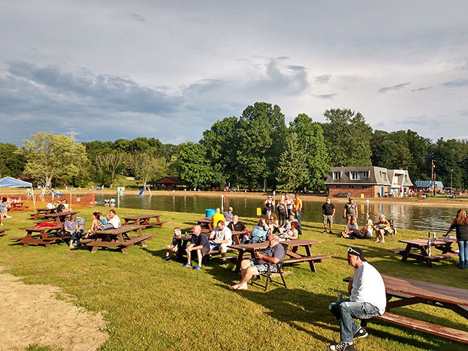 Families gather lakeside at sunset, proving that Mother Nature still throws the best parties when she pairs golden hour with picnic tables.