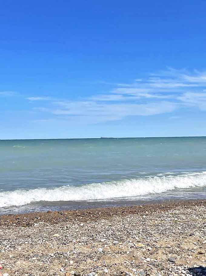 Lake Huron's gentle waves create nature's most soothing soundtrack, rolling endlessly onto the shore like time itself made visible.