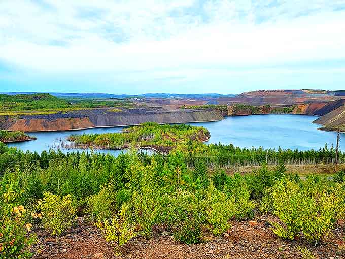Nature and industry create an unlikely harmony at this hidden Minnesota gem, where azure waters fill former mining pits like jewels.