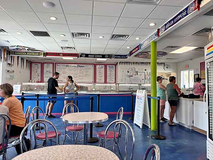 Retro chrome tables and classic diner chairs create a nostalgic backdrop for ice cream adventures, while sports pennants add splashes of color overhead.