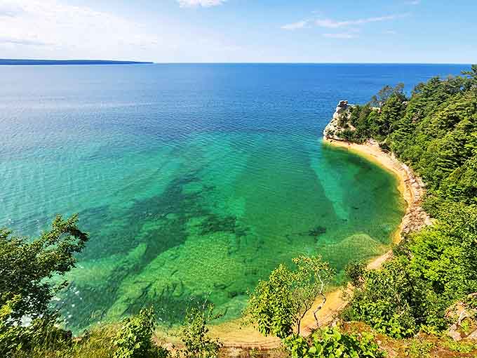Aerial majesty captured in perfect harmony &ndash; Lake Superior's turquoise waters embrace the curved shoreline like a lover's gentle caress.