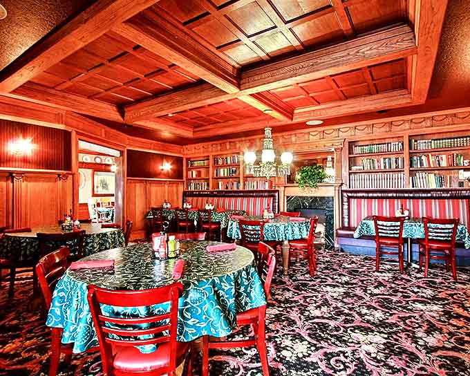 Rich wooden paneling, coffered ceilings, and cozy reading nooks transform dining into a warm embrace of old-world charm.