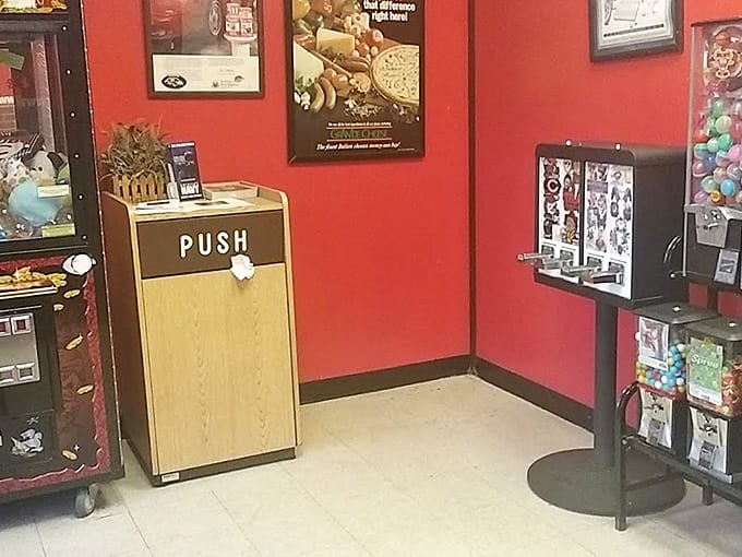 Simple red walls and vintage photos create the cozy vibe where great pizza memories are born every single day.