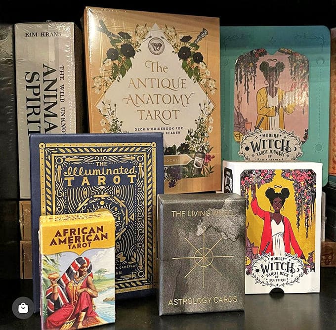 A bibliophile's dream collection of tarot decks, from the African American Tarot to the Illuminated Tarot, each promising different pathways to wisdom.