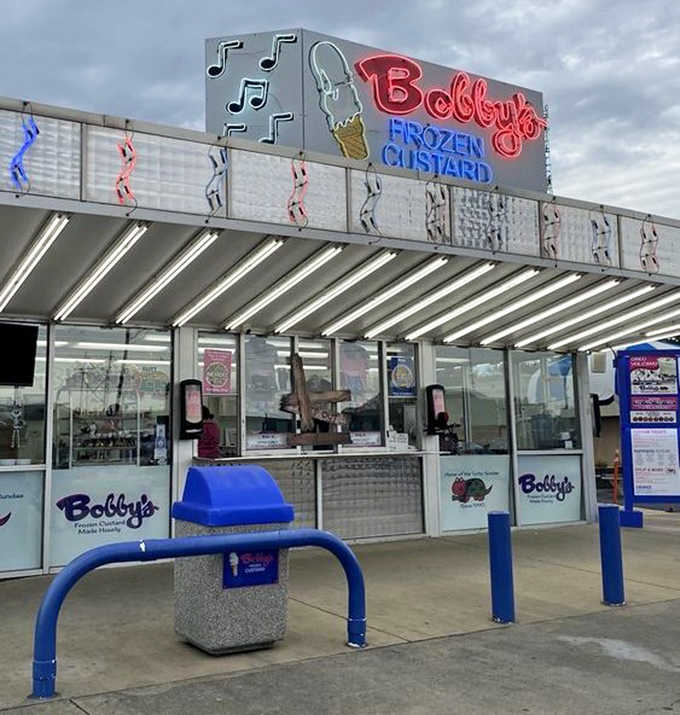 The order windows buzz with activity as customers eagerly await their frozen treasures, each creation made with practiced precision.