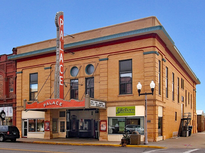 The Palace Theatre's vintage marquee glows with promise, beckoning moviegoers just as it has for generations.