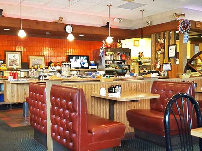 Red vinyl booths and wood paneling create that perfect "been here forever" vibe where comfort trumps trendiness every single time.