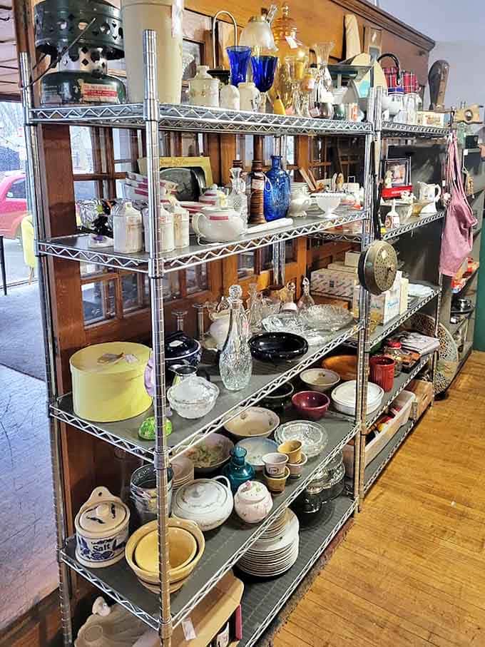 Crystal glassware catches the light while vintage china waits patiently for its next dinner party &ndash; everyday elegance at thrift store prices.