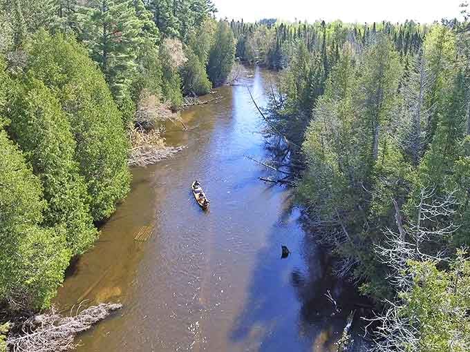 The Au Sable River flows like liquid crystal, a paradise for paddlers and a sanctuary for the soul.