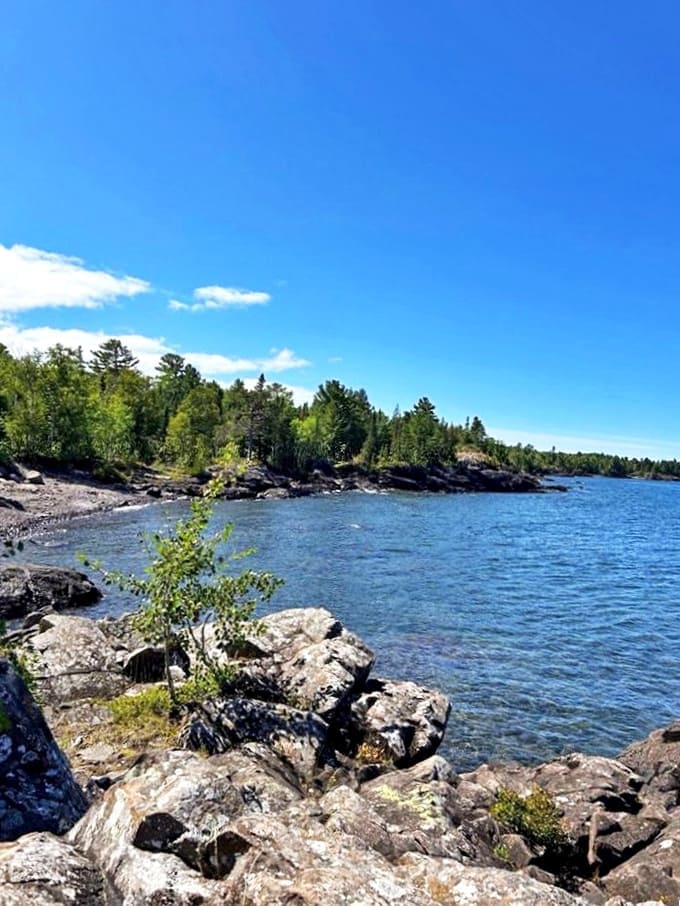 Smooth stones meet Lake Superior's legendary waters, creating a natural mosaic that changes with each gentle wave.