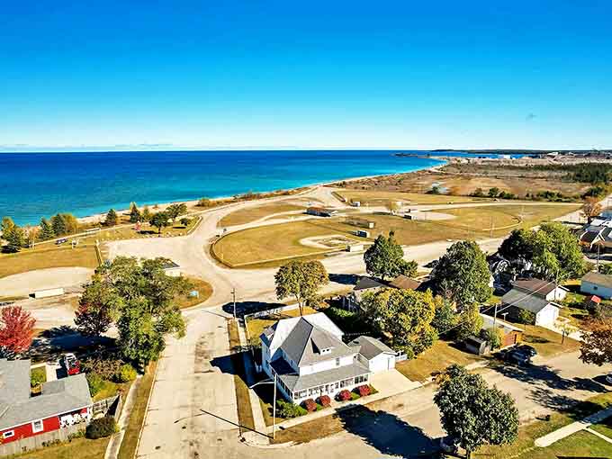 Aerial dreams come true with this bird's-eye view of Rogers City's harbor and shoreline, where blue meets green in perfect harmony.