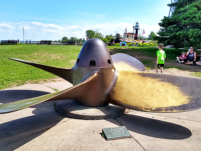 This massive ship propeller stands as a bronze testament to Lake Superior's maritime heritage, fascinating children and engineering buffs alike with its impressive scale.