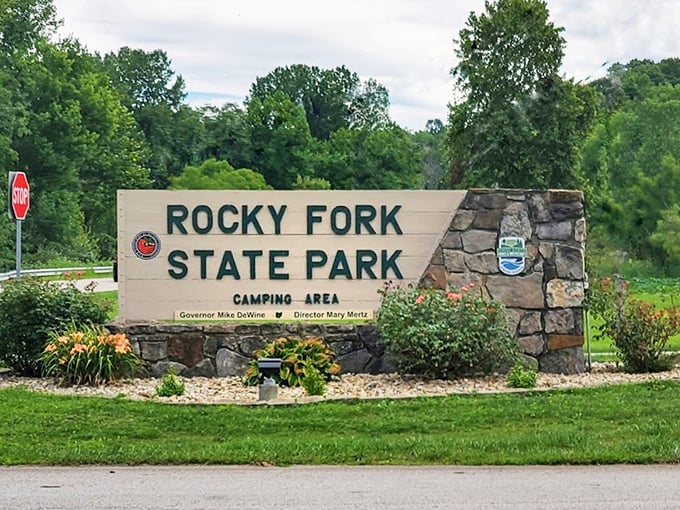 The welcoming stone entrance sign &ndash; your official invitation to leave stress behind and enter nature's playground.