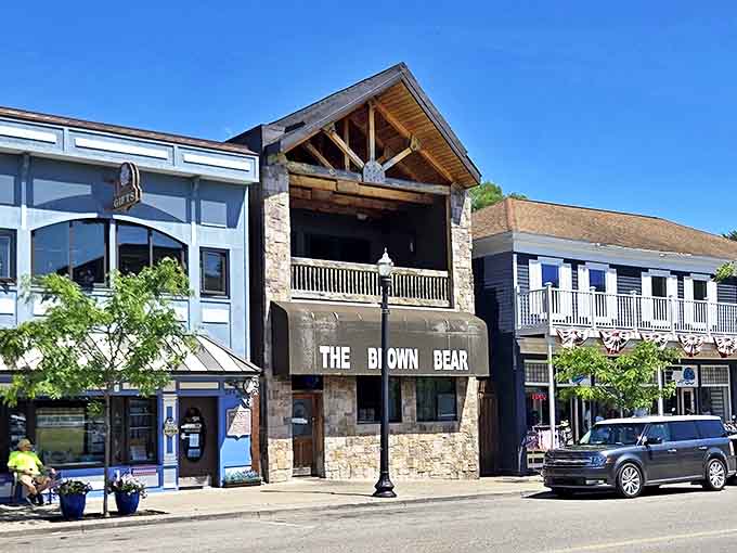 The Brown Bear restaurant stands as Pentwater's rustic gathering spot, where stone meets wood and hungry patrons meet satisfaction.