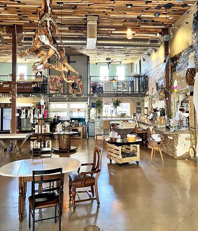 Reclaimed wood ceilings and industrial-chic design create a two-story wonderland where coffee meets art, with driftwood sculptures defying gravity overhead.