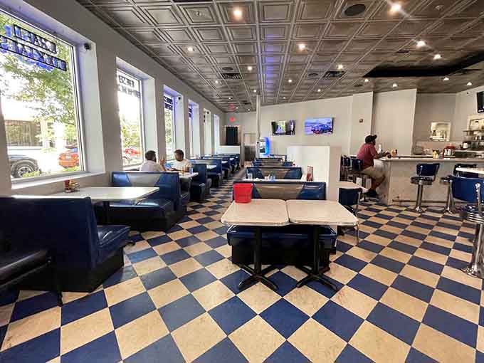 Classic checkerboard floors and blue booths create the perfect setting for serious milkshake consumption and people-watching.