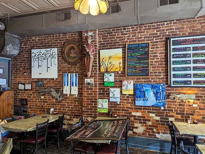Exposed brick, eclectic art, and cozy booths create the perfect setting for a meal that feels like coming home.