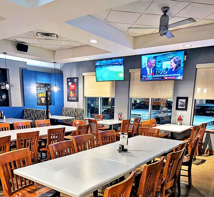 Inside, wooden chairs and blue walls create the perfect casual atmosphere for serious burger business and game-day gatherings.
